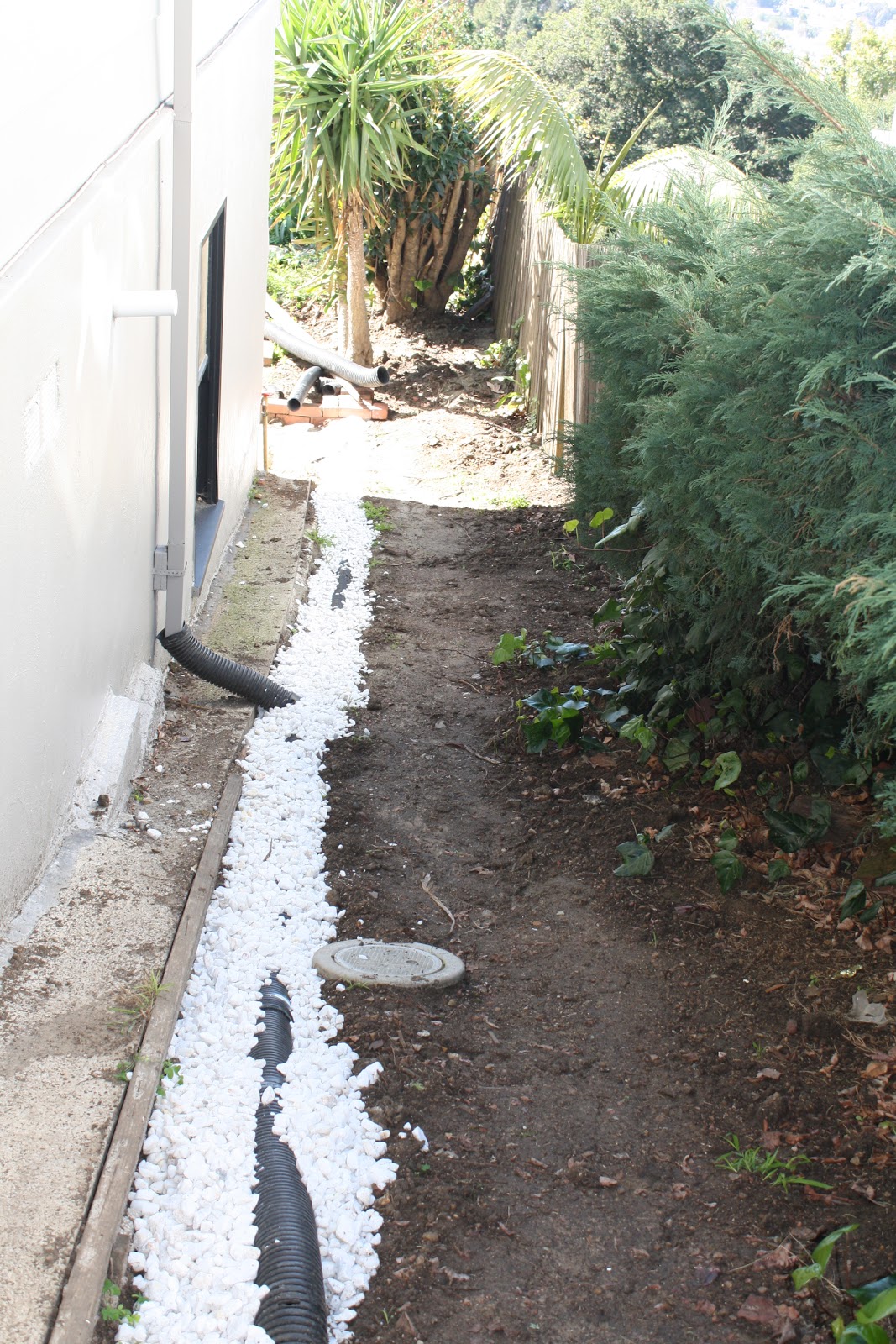 Sunkist Drive: DIY Trenches and Fences and Stair Rails and Ceiling Patches